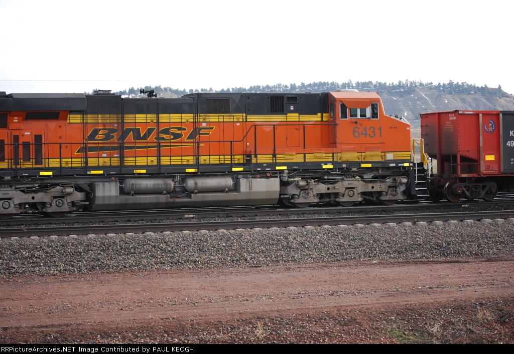BNSF 6431 heads west as she pulls a mty coal train as the second unit.
